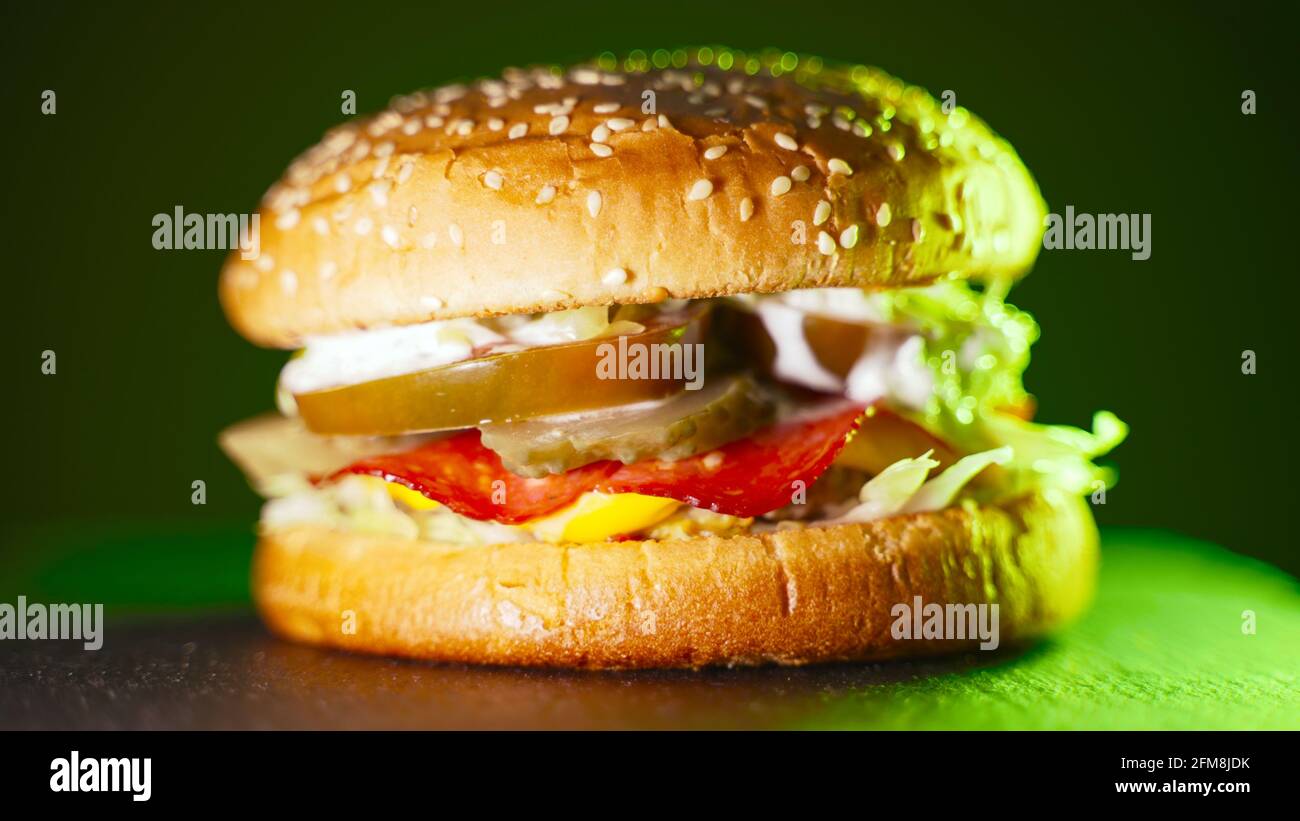 Rustic homemade hamburger with neon backlight Stock Photo - Alamy