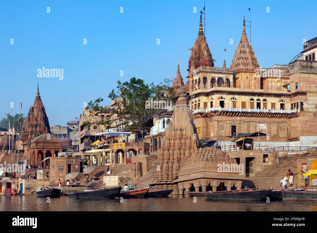 Temples on the Hindu Ghats on the banks of the Holy River Ganges at ...