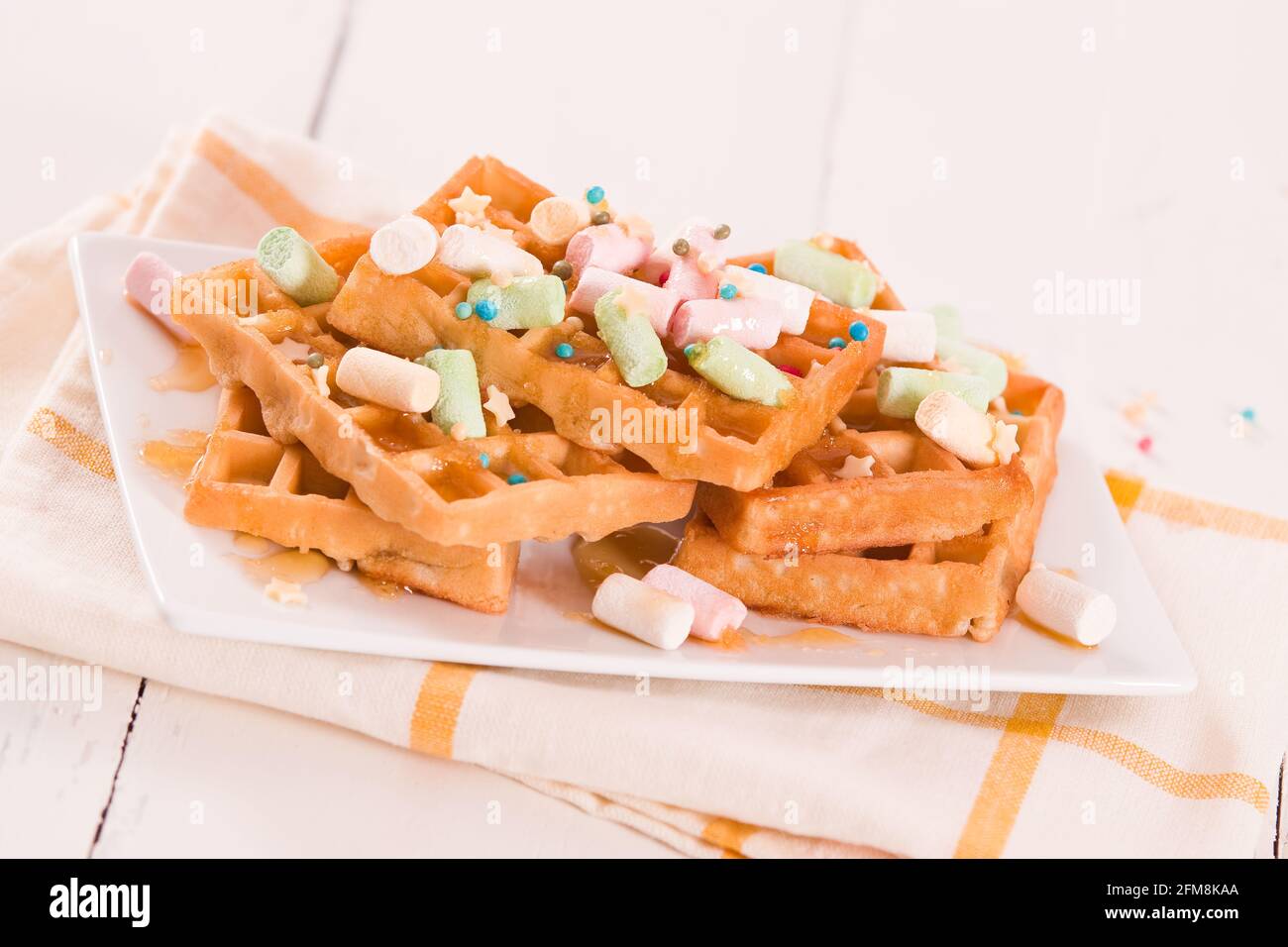 Waffles with colourful marshmallow Stock Photo - Alamy