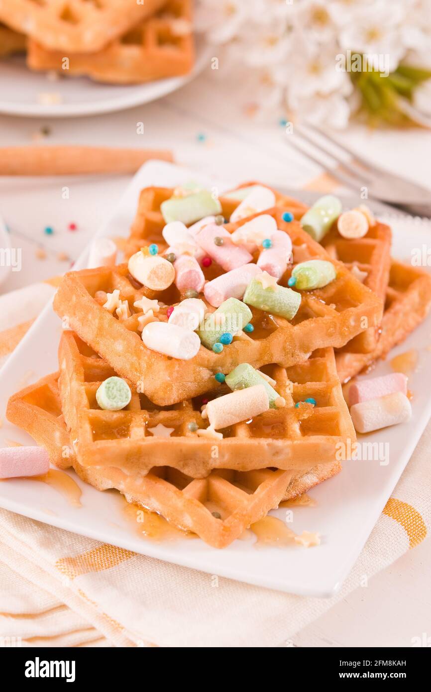 Waffles with colourful marshmallow Stock Photo - Alamy