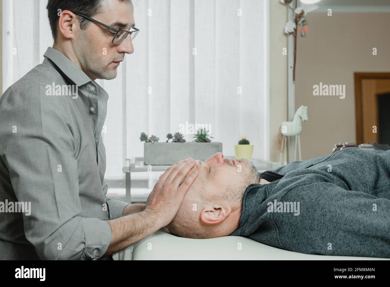 Craniosacral therapy hi-res stock photography and images - Alamy