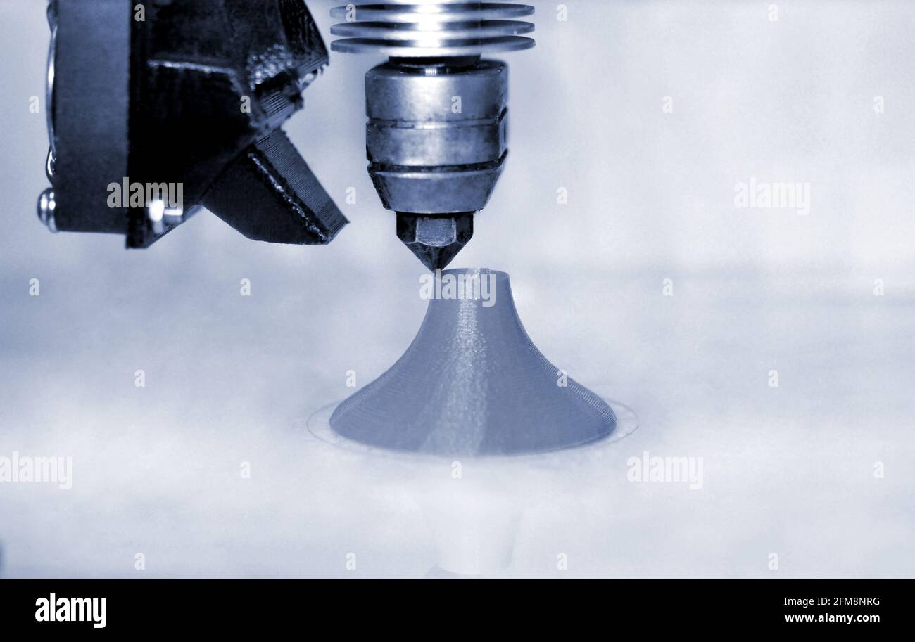 Modern 3D printer printing figure blue colors close-up Stock Photo - Alamy