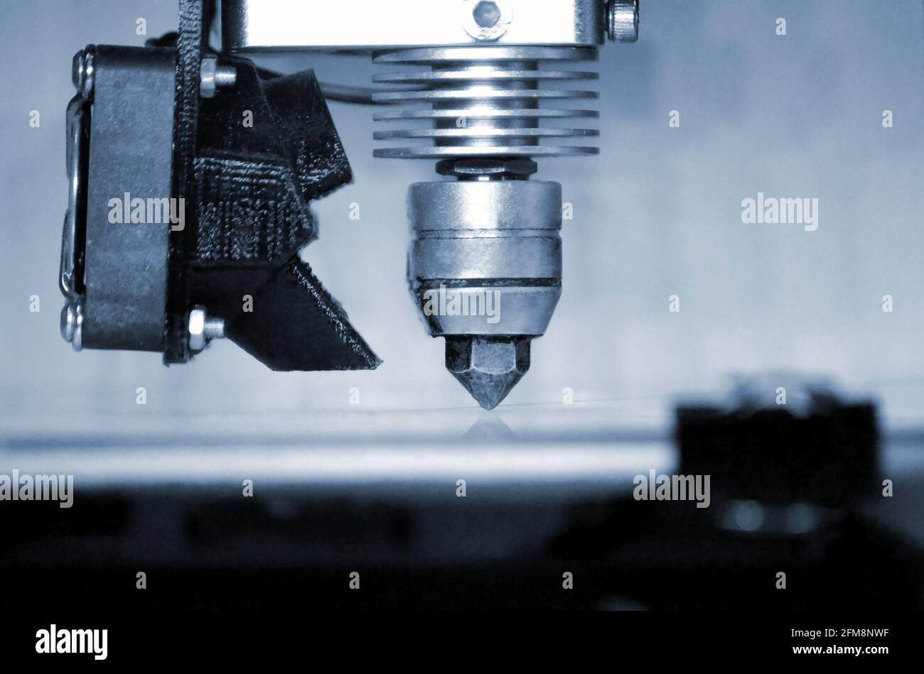 Modern 3D printer printing figure close-up. Automatic three dimensional ...