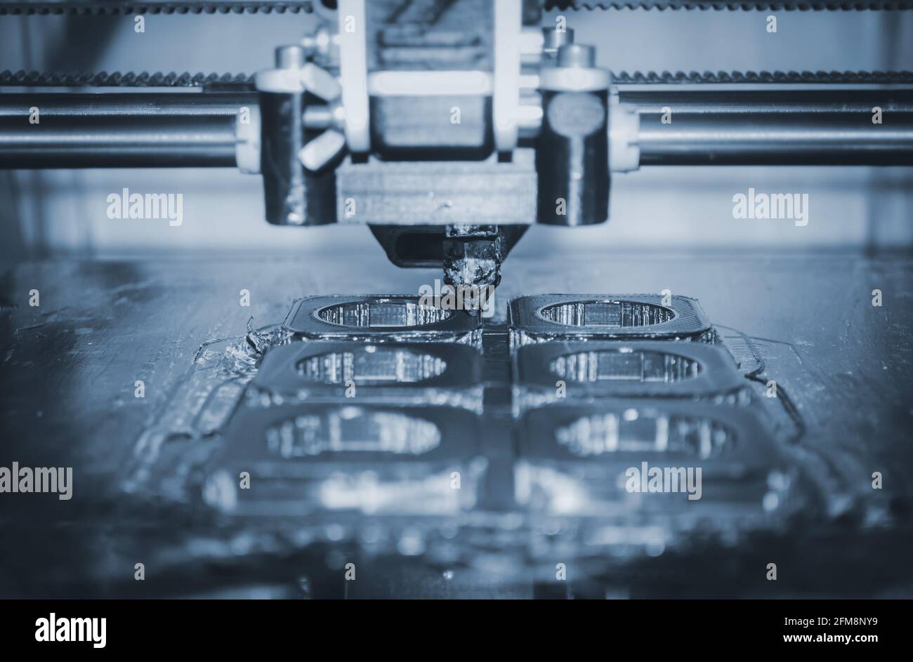 Modern 3D printer printing figure close-up. Automatic three dimensional ...