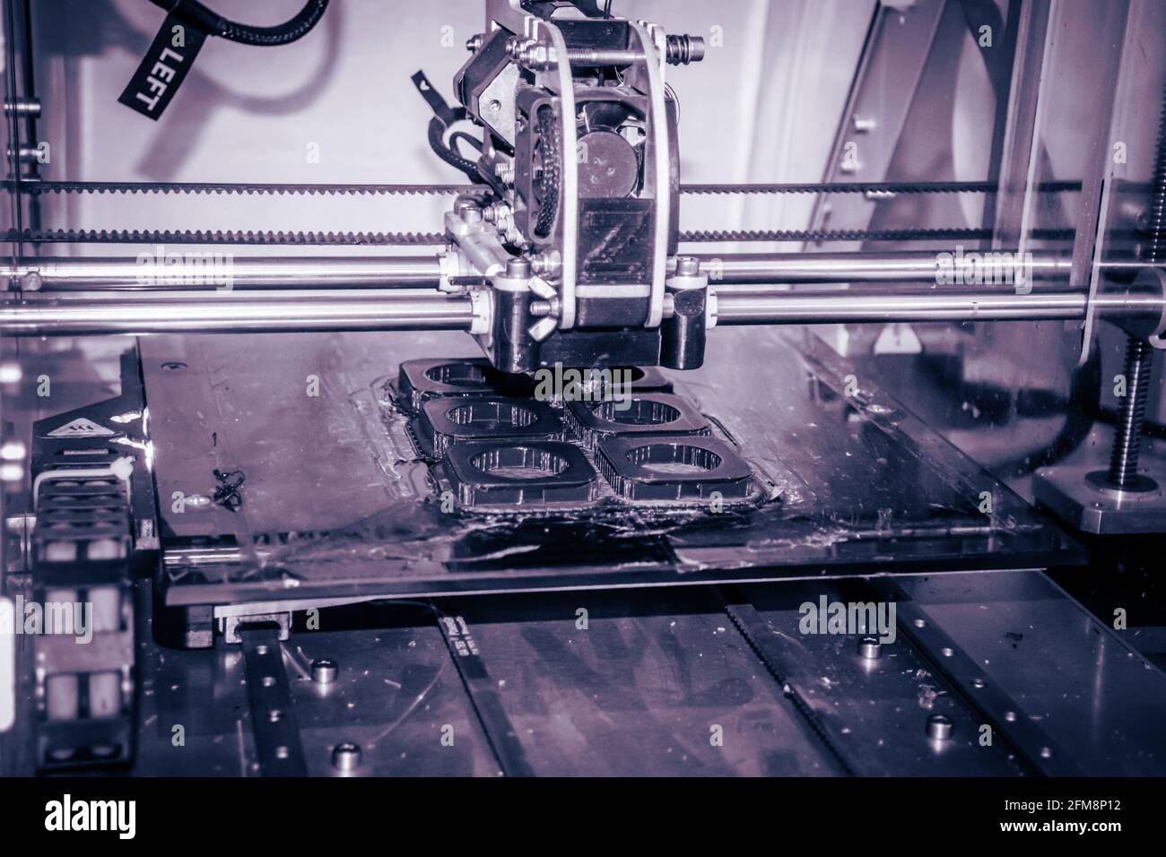 Modern 3D printer printing figure close-up. Automatic three dimensional ...