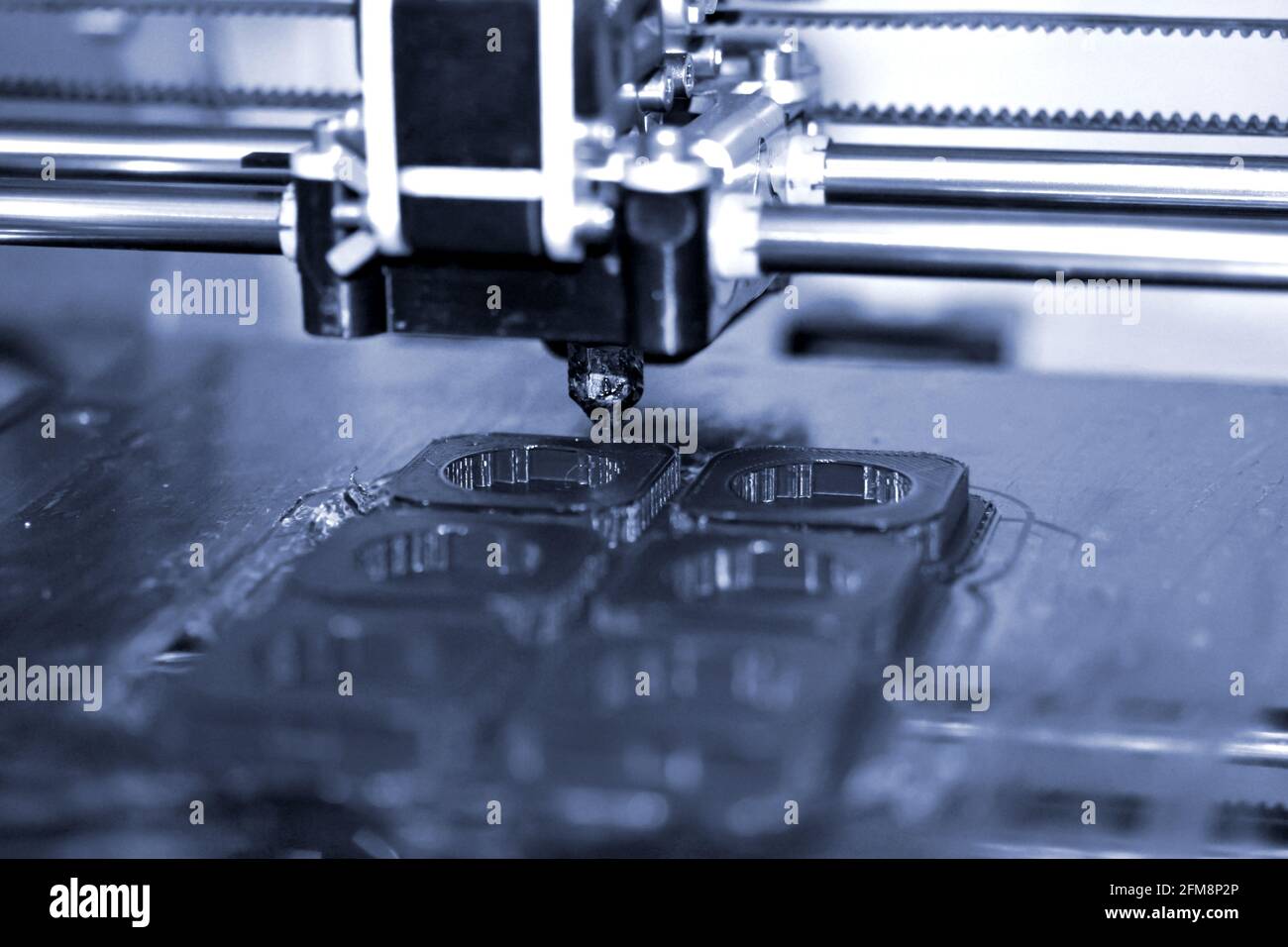 Modern 3D printer printing figure close-up. Automatic three dimensional ...