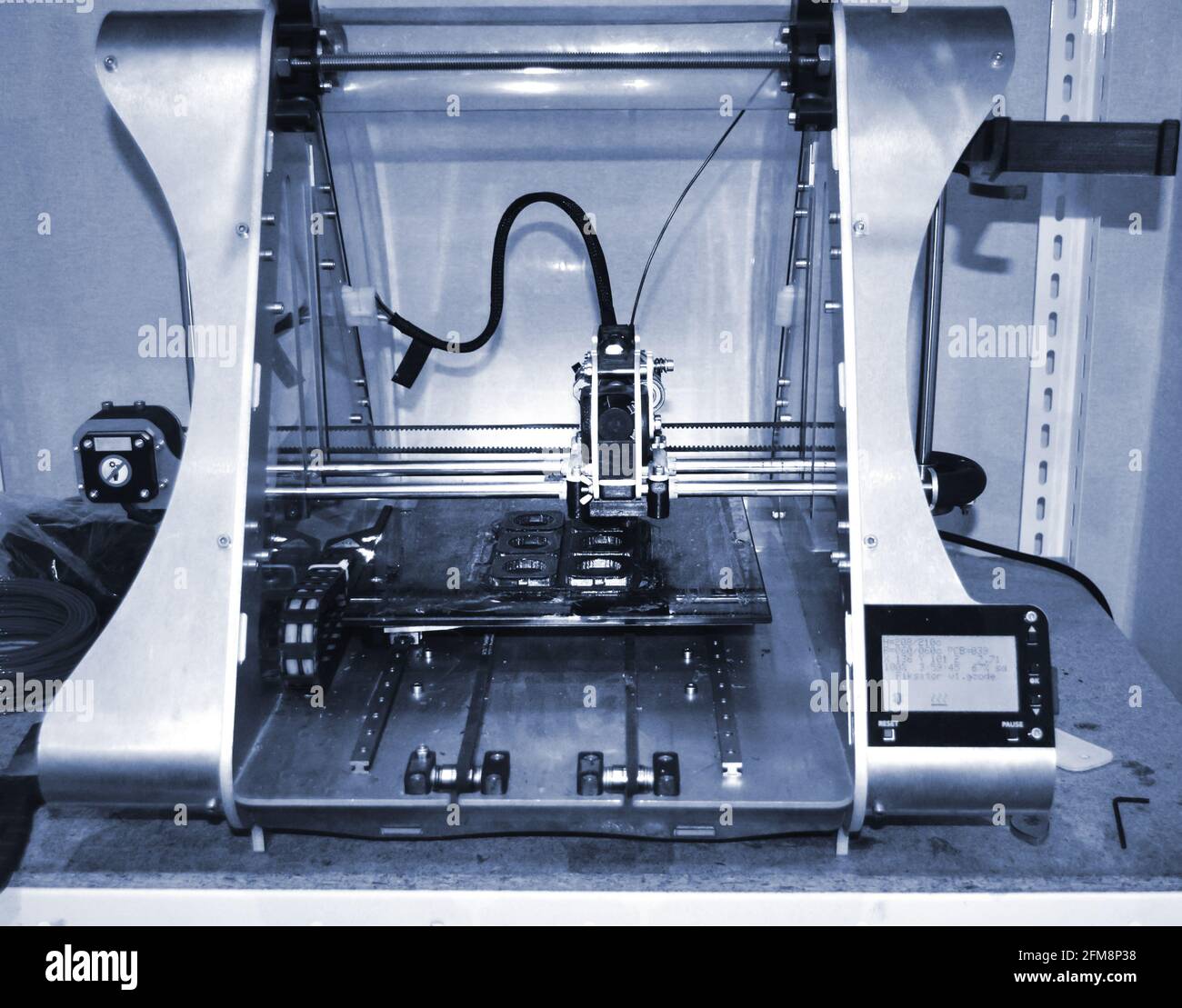 Modern 3D printer printing figure close-up. Automatic three dimensional ...