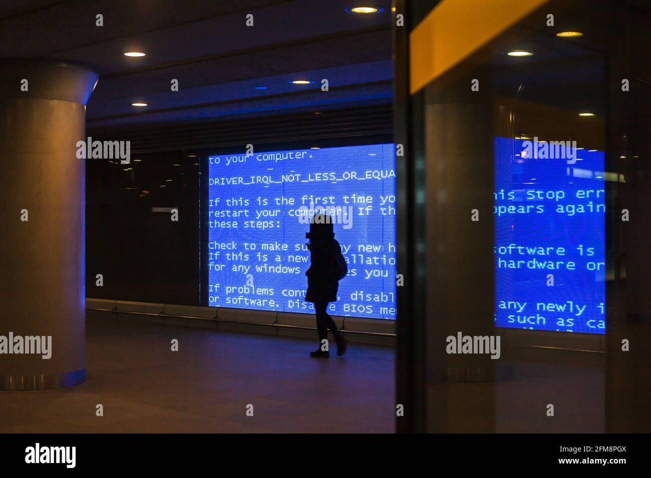 Female walking in a tunnel with binary code walls Stock Photo - Alamy