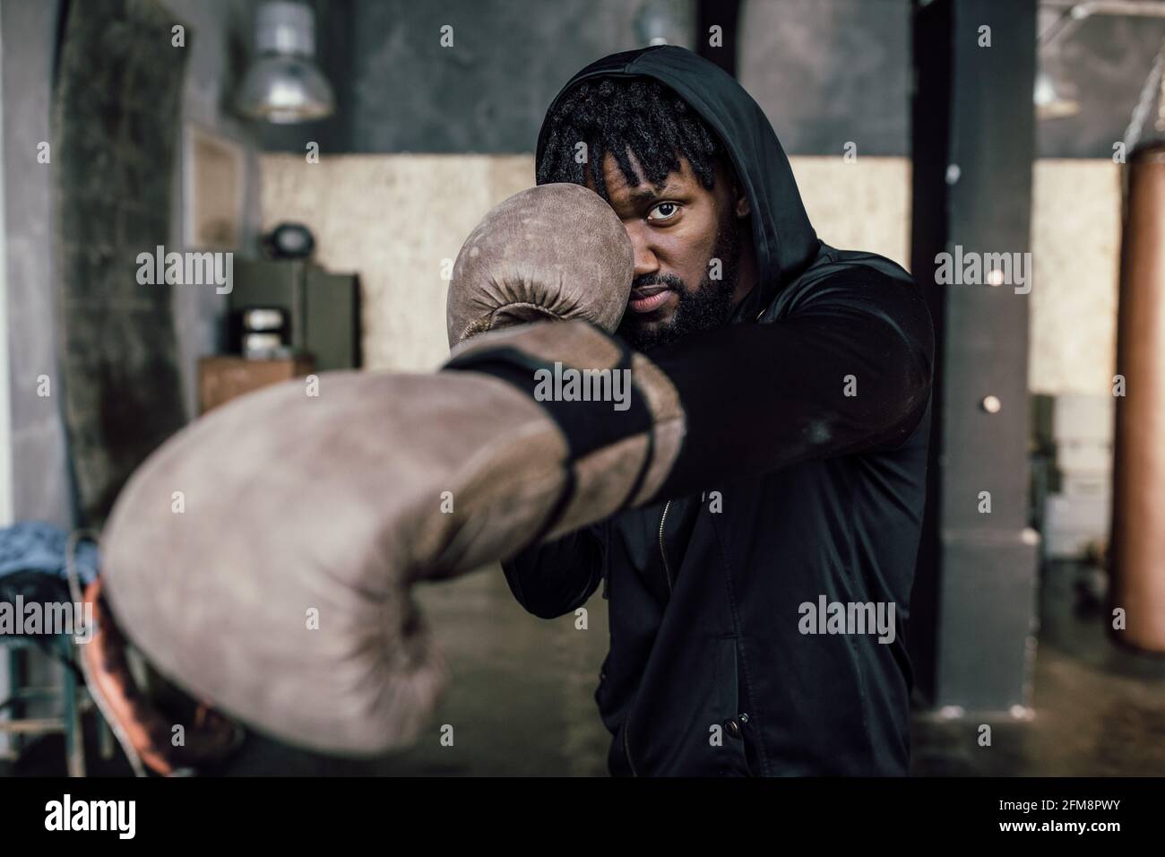 black boxer. Punch to the camera, close-up Stock Photo - Alamy