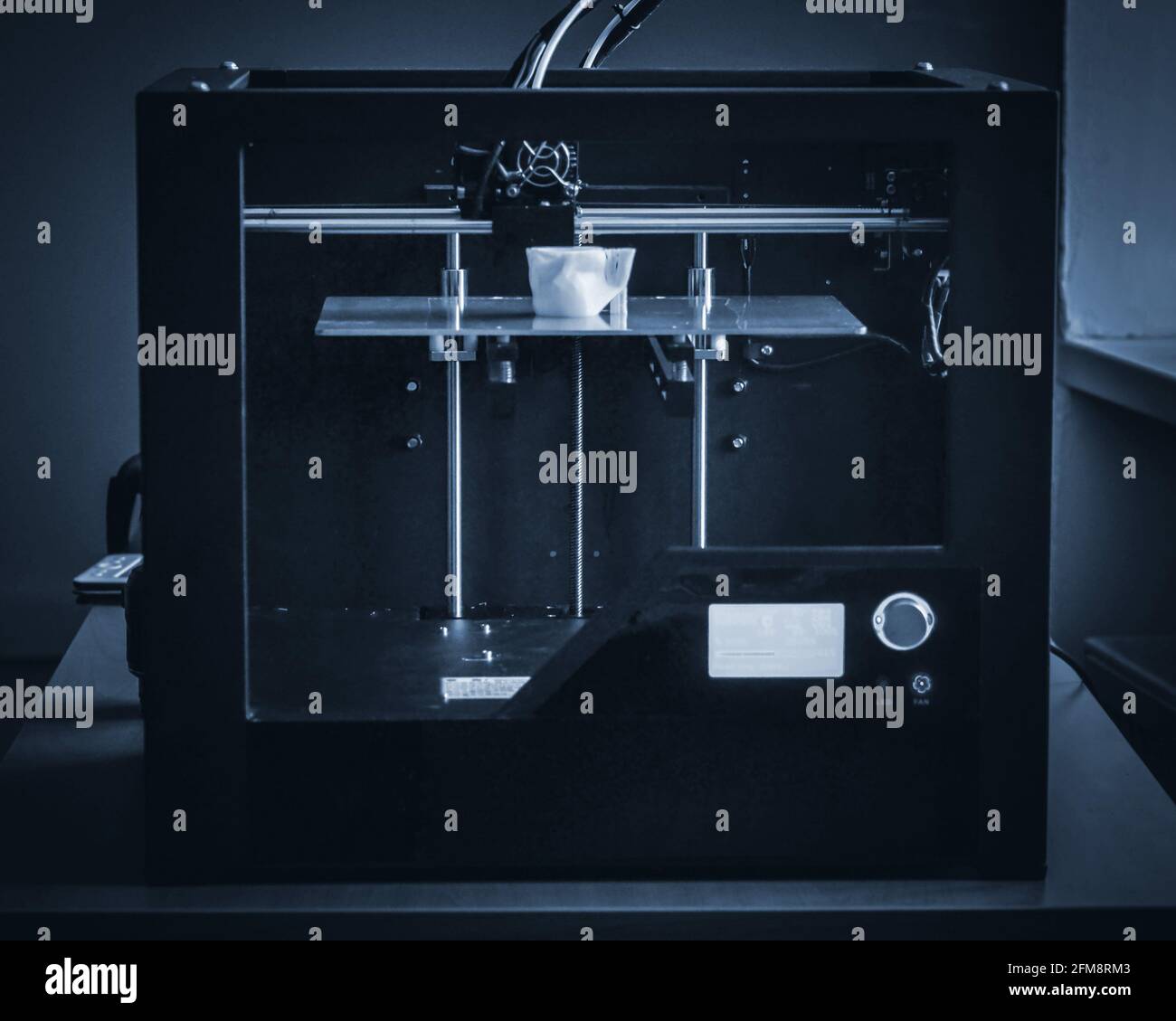 Objects printed by 3d printer. Automatic three dimensional 3d printer ...