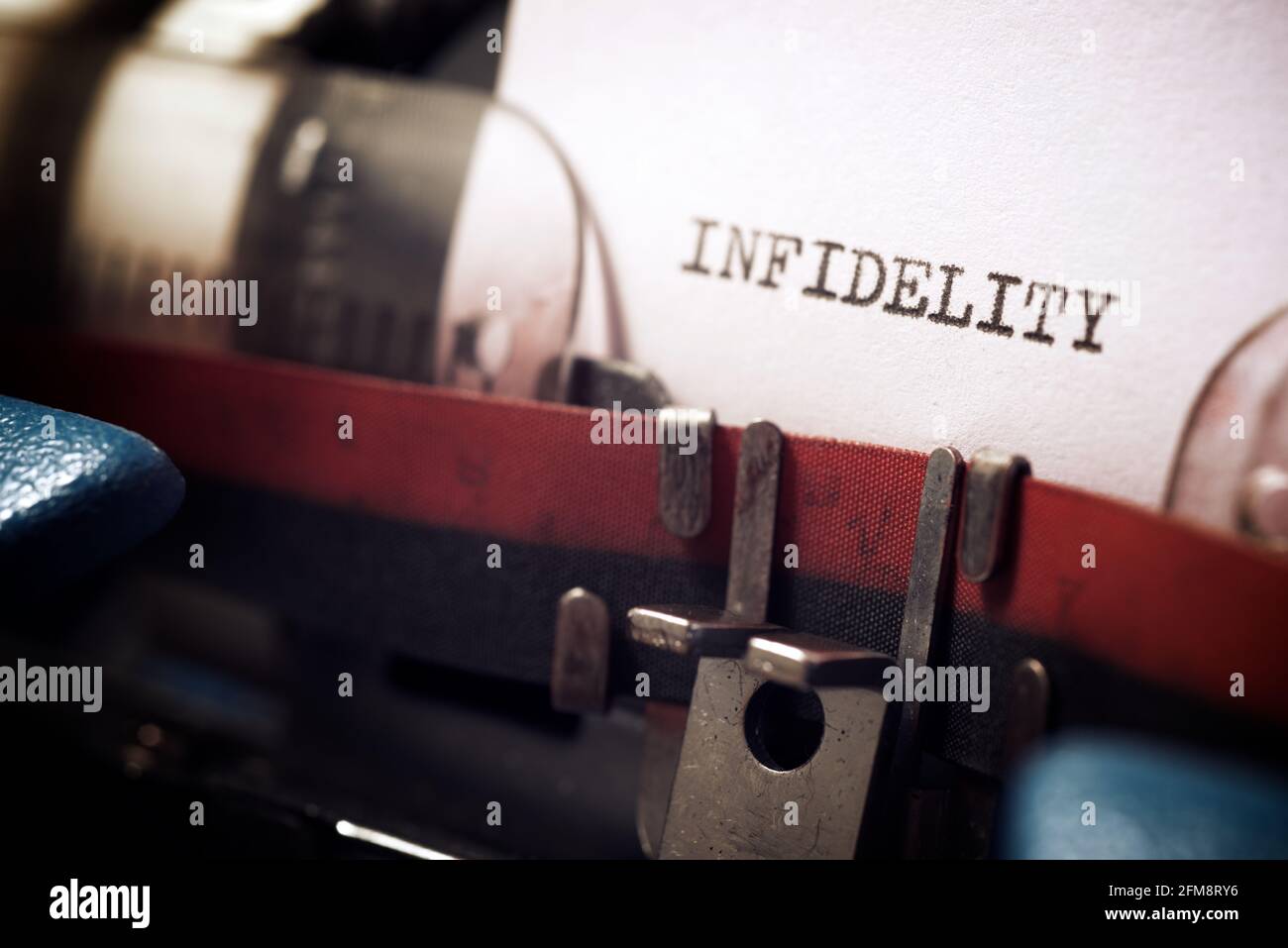 Infidelity word written with a typewriter Stock Photo - Alamy