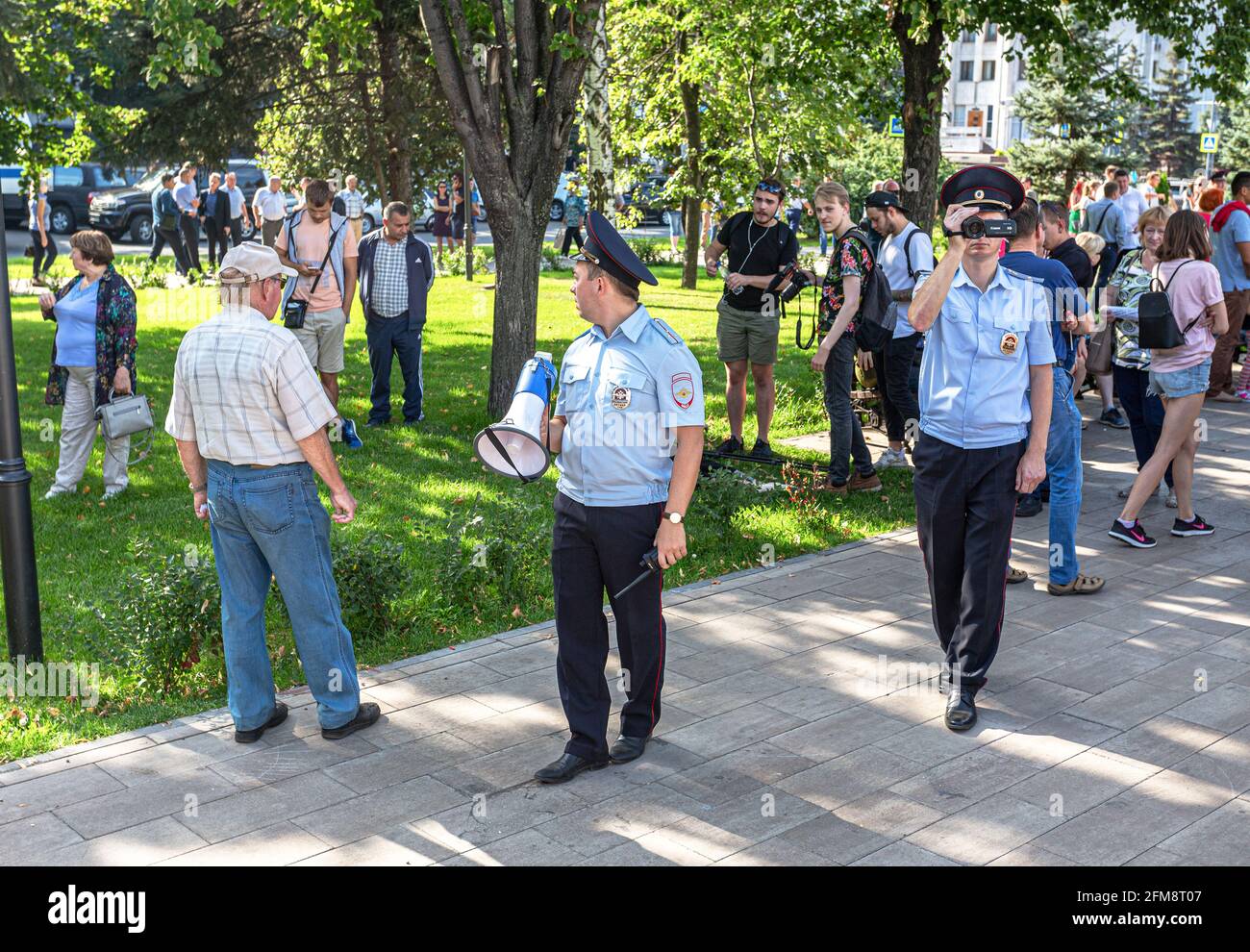 Police officer filming protest hi-res stock photography and images - Alamy