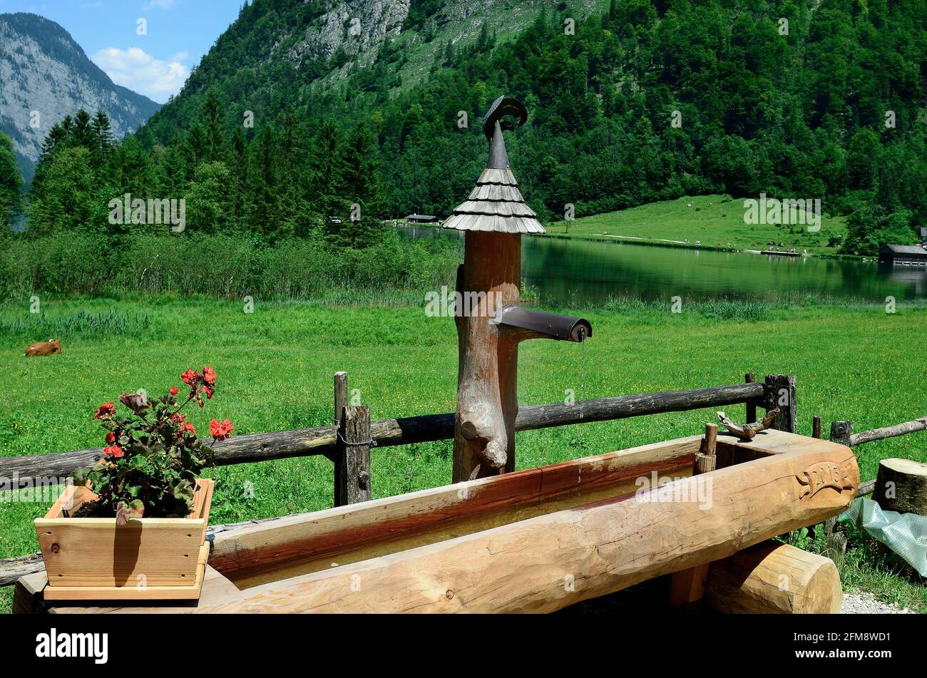 Germany, Koenigssee, drinking water fountain with wooden trough Stock ...