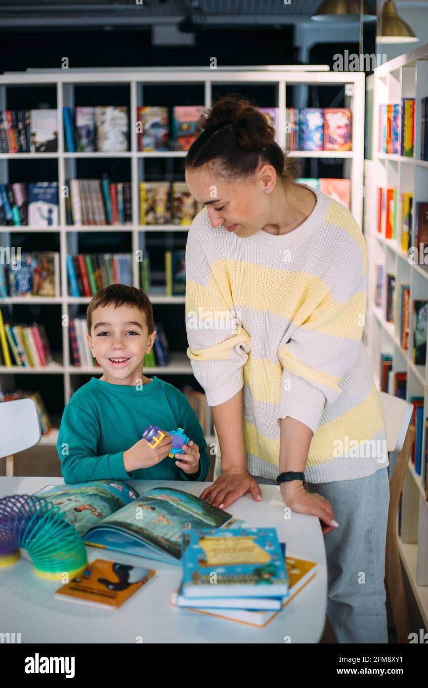 Mom gives her son his first watch. Learning to determine the time by ...