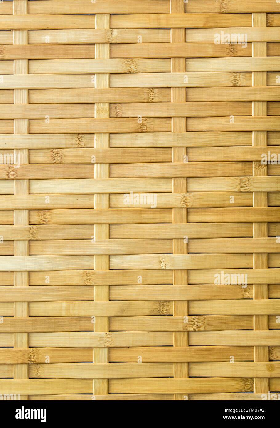 Vertical shot of a weaved bamboo wall for wallpaper and background ...