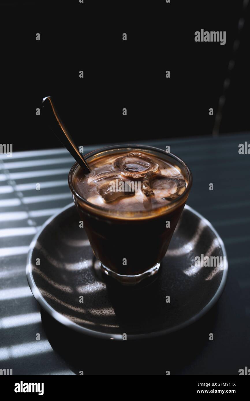 Coffee cup in light and shadow Stock Photo - Alamy