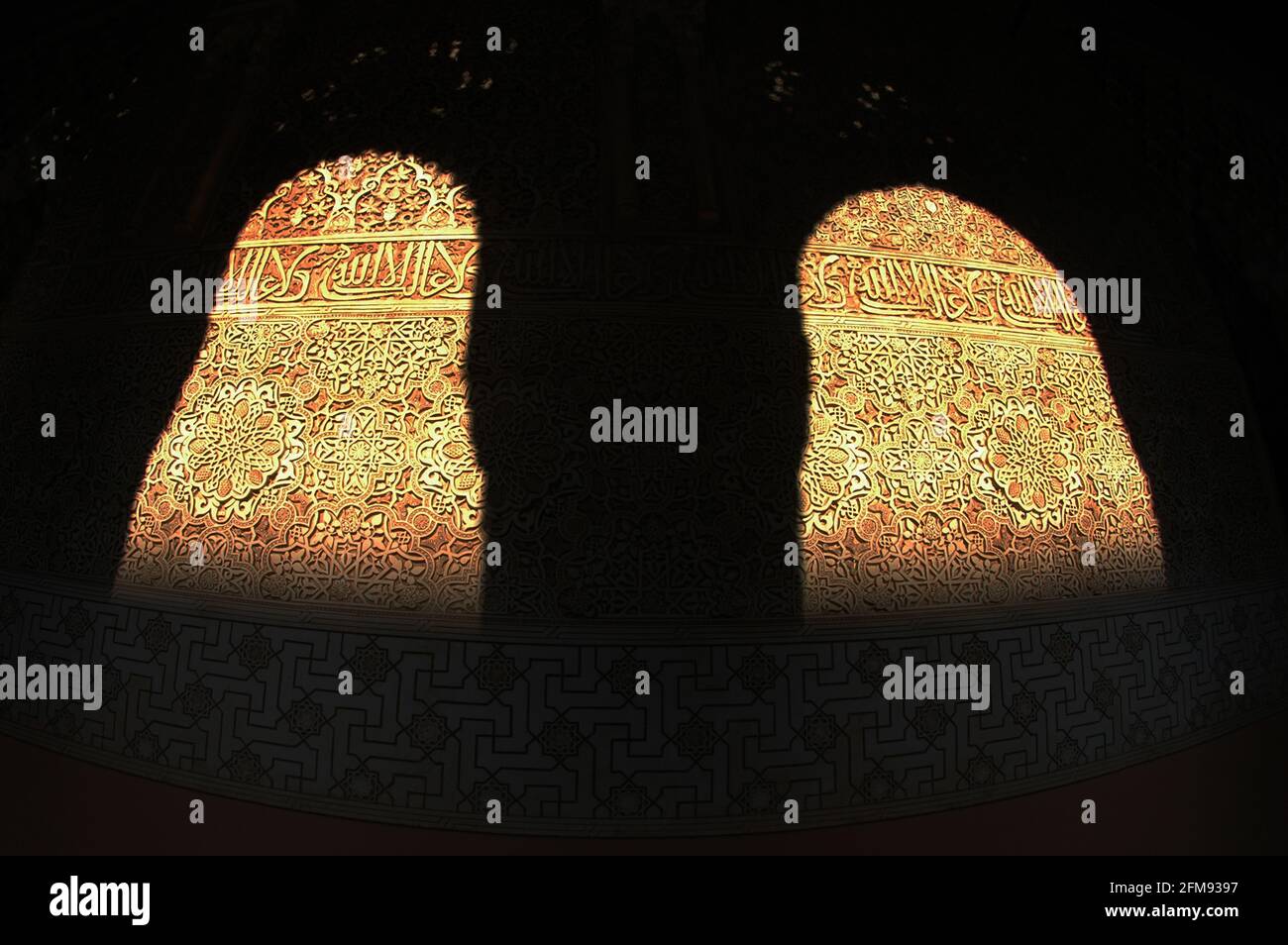 Pair of arch shadows on carvings, Alhambra, Granada, Andalucia, Spain ...