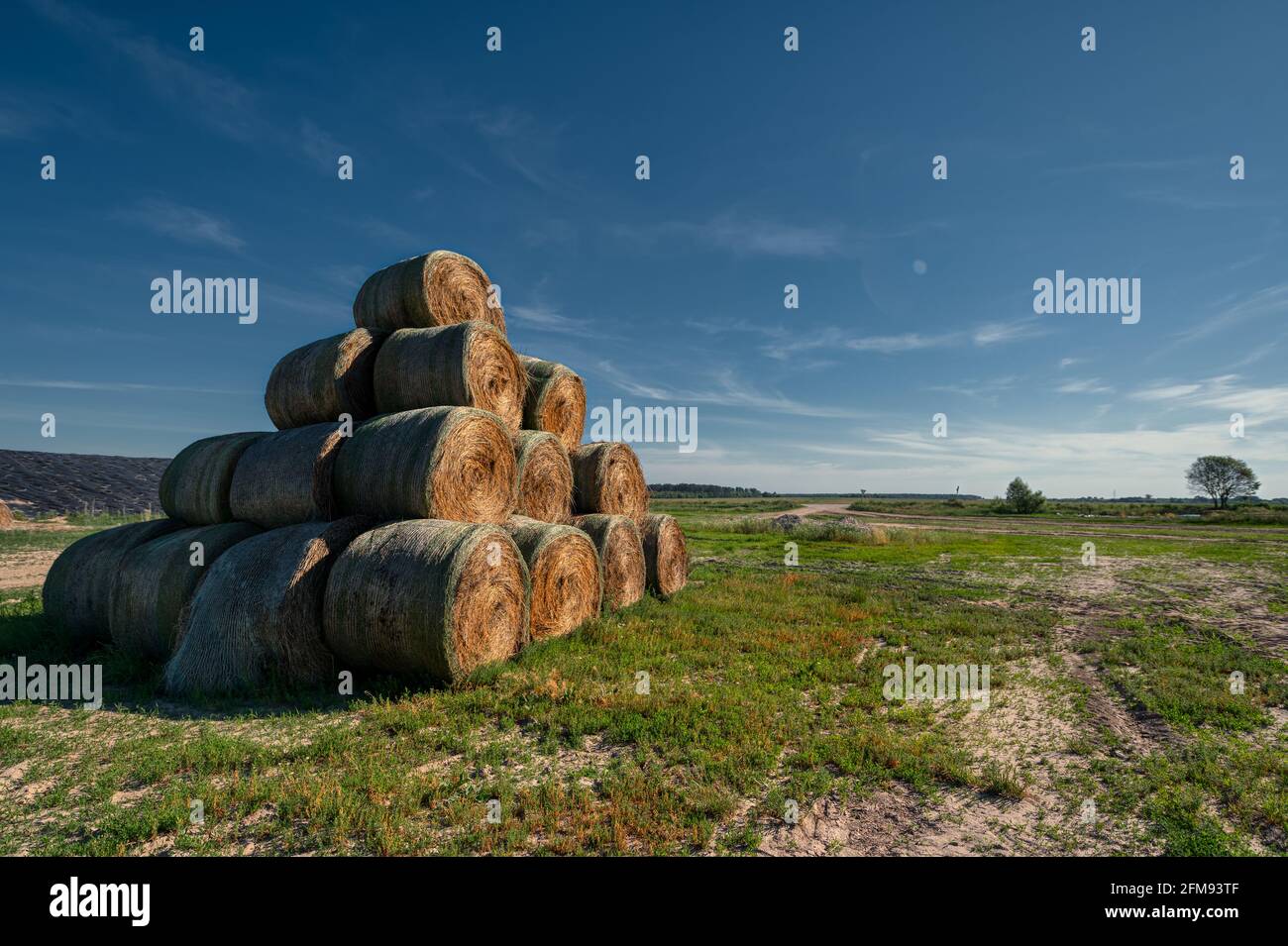 The straw bales are stacked in a large pile Stock Photo - Alamy