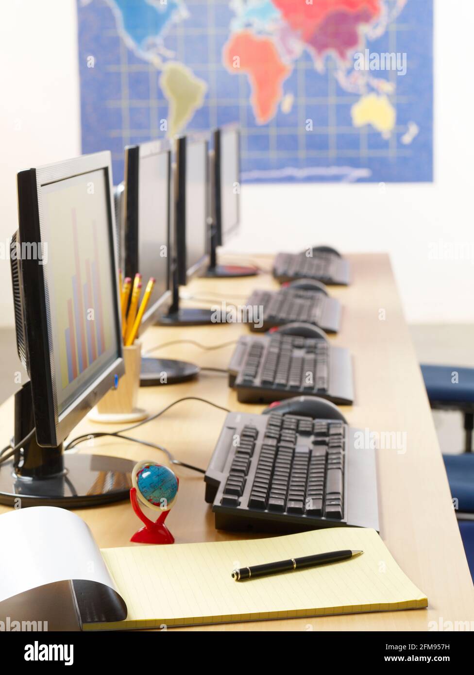 STILL LIFE OF A SCHOOL/COLLEGE CLASS DESK WITH COMPUTERS Stock Photo ...