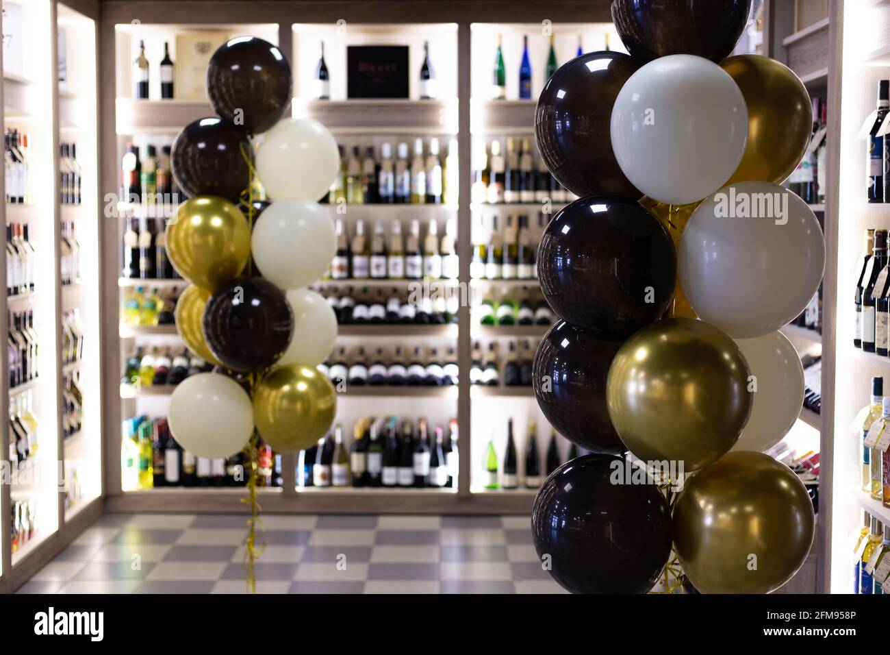 The alcohol store is decorated with balloons on the occasion of the ...