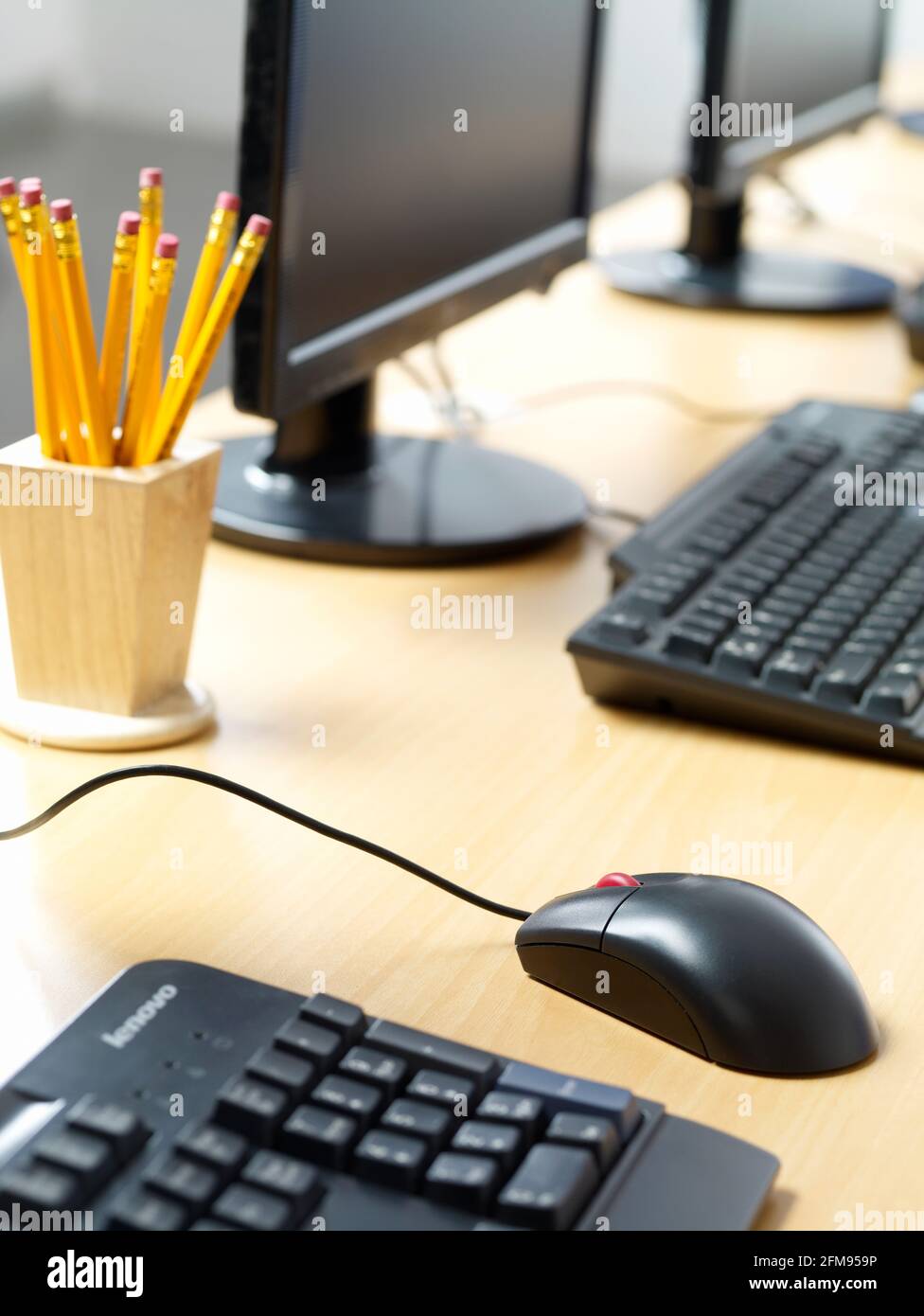 STILL LIFE OF A SCHOOL/COLLEGE CLASS DESK WITH COMPUTERS Stock Photo ...