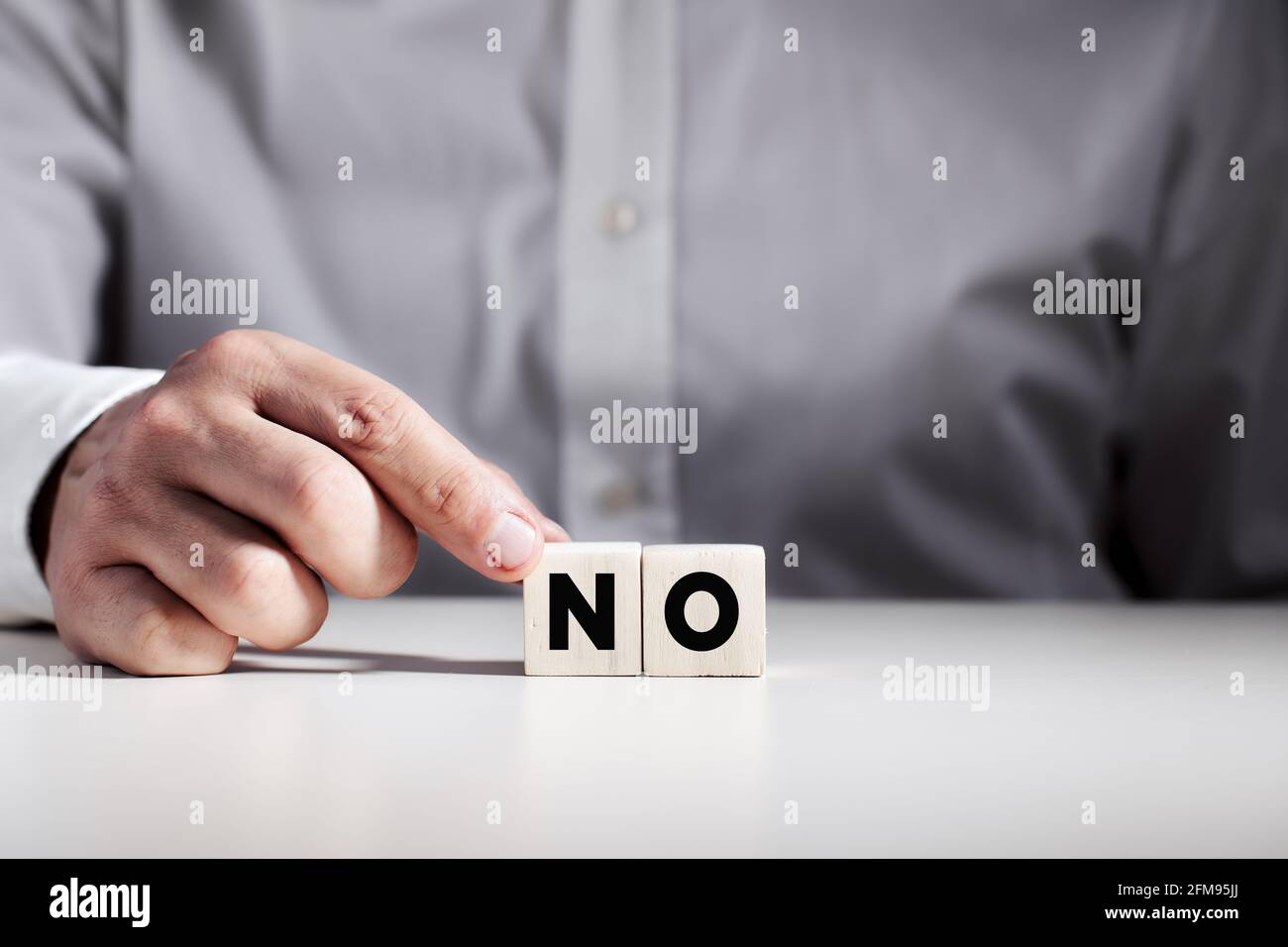 Hand places wooden cubes hi-res stock photography and images - Alamy