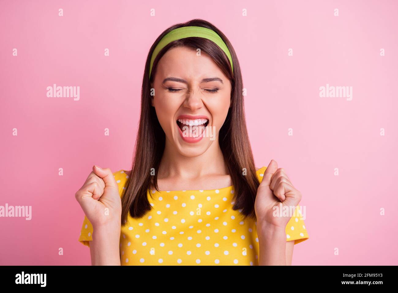 Portrait of hooray pretty brunette girl hands fists yell closed eyes ...