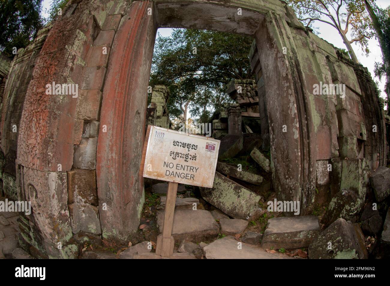 Sign warning no entry danger at entrance, Ta Prohm temple, Angkor ...