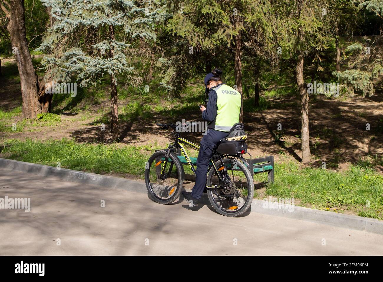 Police woman on a bicycle. Park police officer patrol in uniform Stock ...