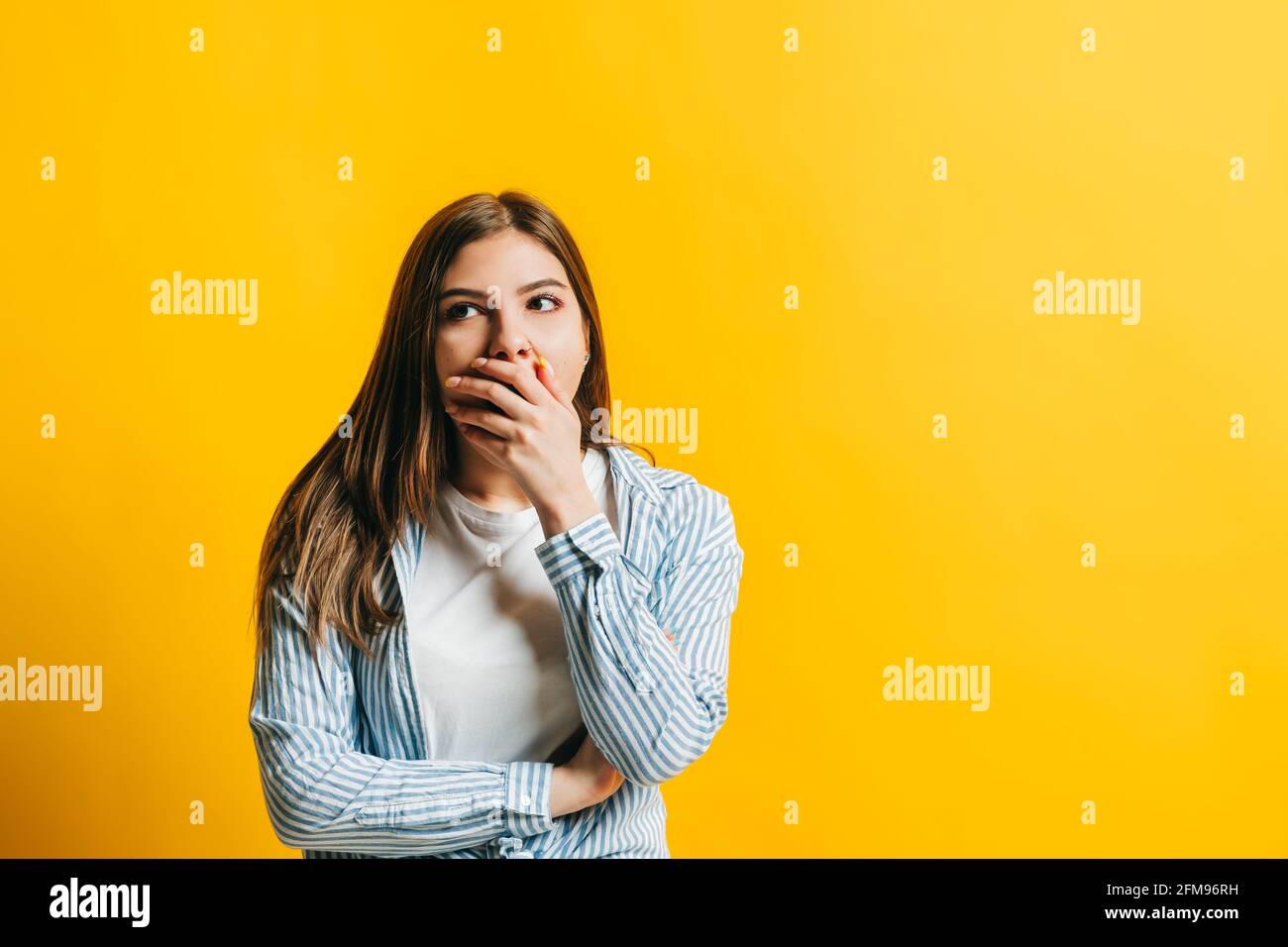 Portrait of excited young woman surprised by something expresses shock ...