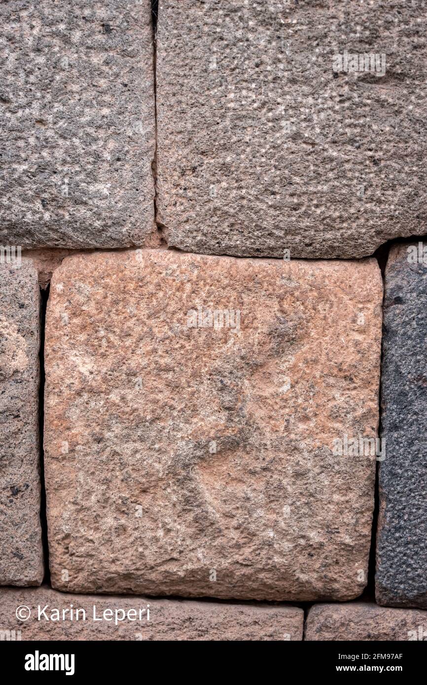 Incan stonework with raised image of a snake in Cusco, Peru Stock Photo ...