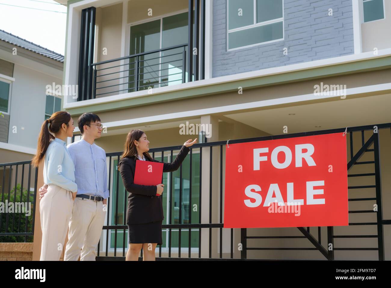 Real Estate Agent Asian Family High Resolution Stock Photography and ...