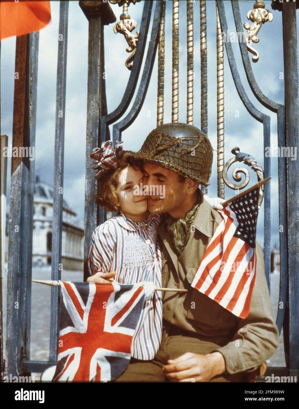 World War II two An American soldier with a British girl holding a ...