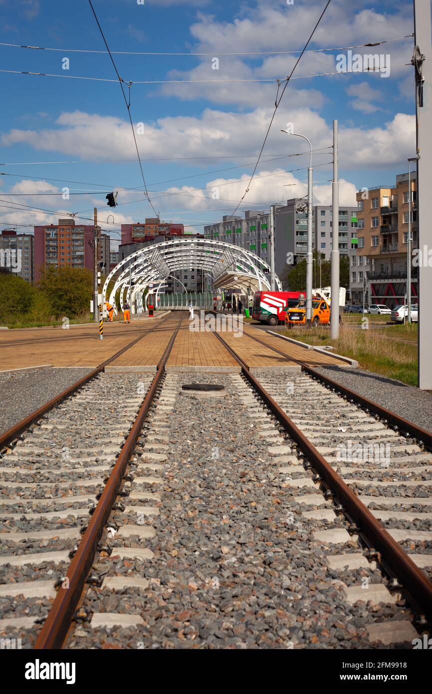 The tram train tracks come towards us at the tram station with ...