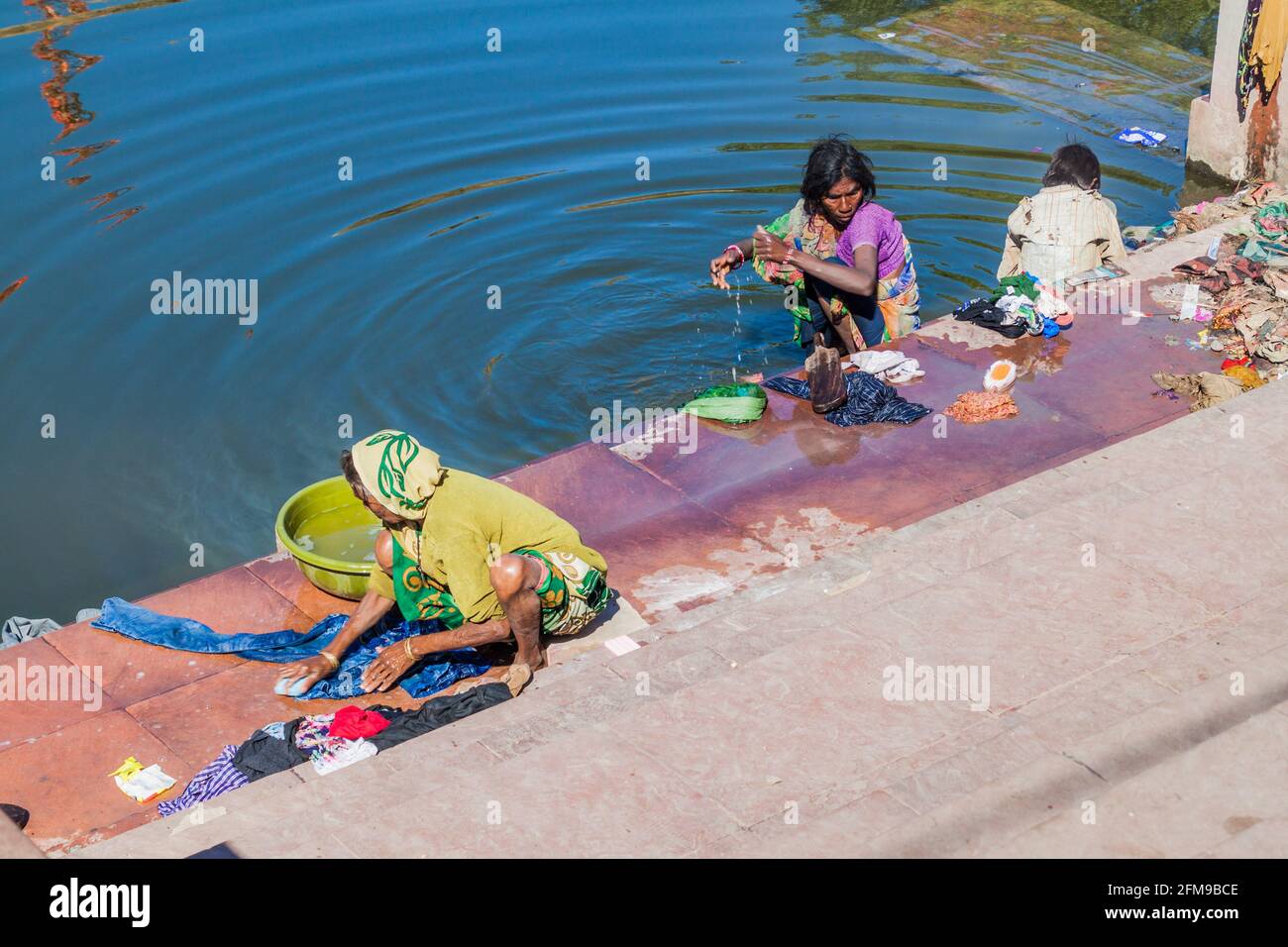 Indian women washing clothes village hi-res stock photography and ...