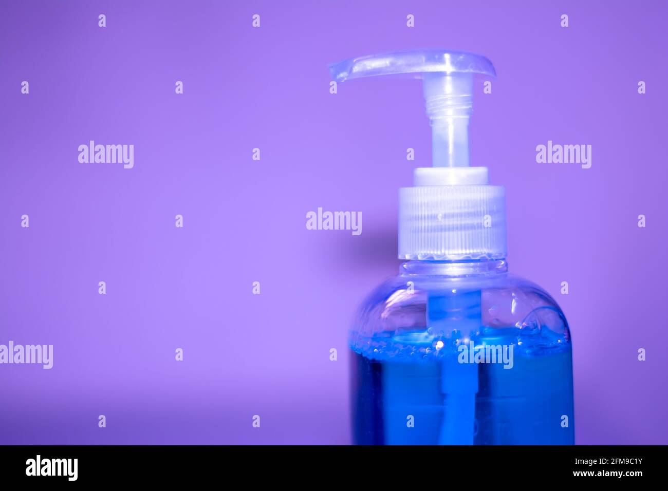 Blue bottles of hand sanitizer and anti-bacterial hand gel, Hand ...