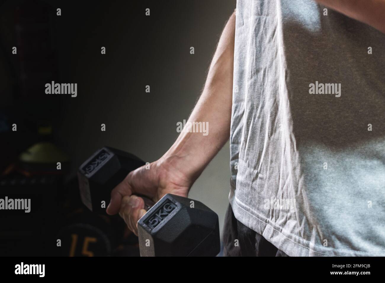 Close up male hand lifting up a dumbbell hi-res stock photography and ...