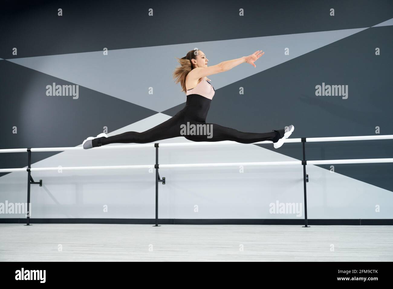 Flexible young ballet dancer stretching hi-res stock photography and ...
