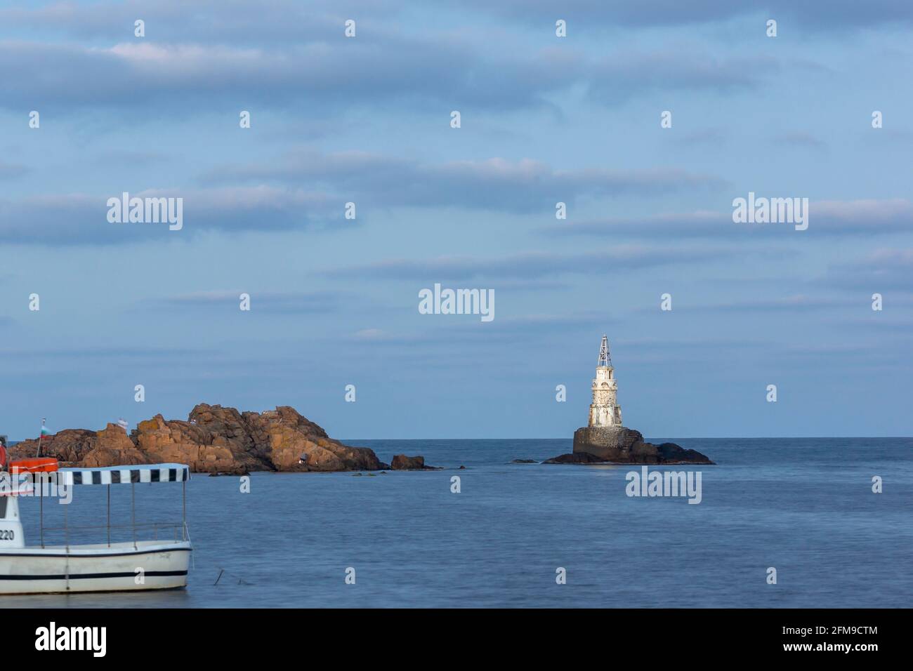 Amazing sunset view of lighthouse town of Ahtopol, Burgas Region ...
