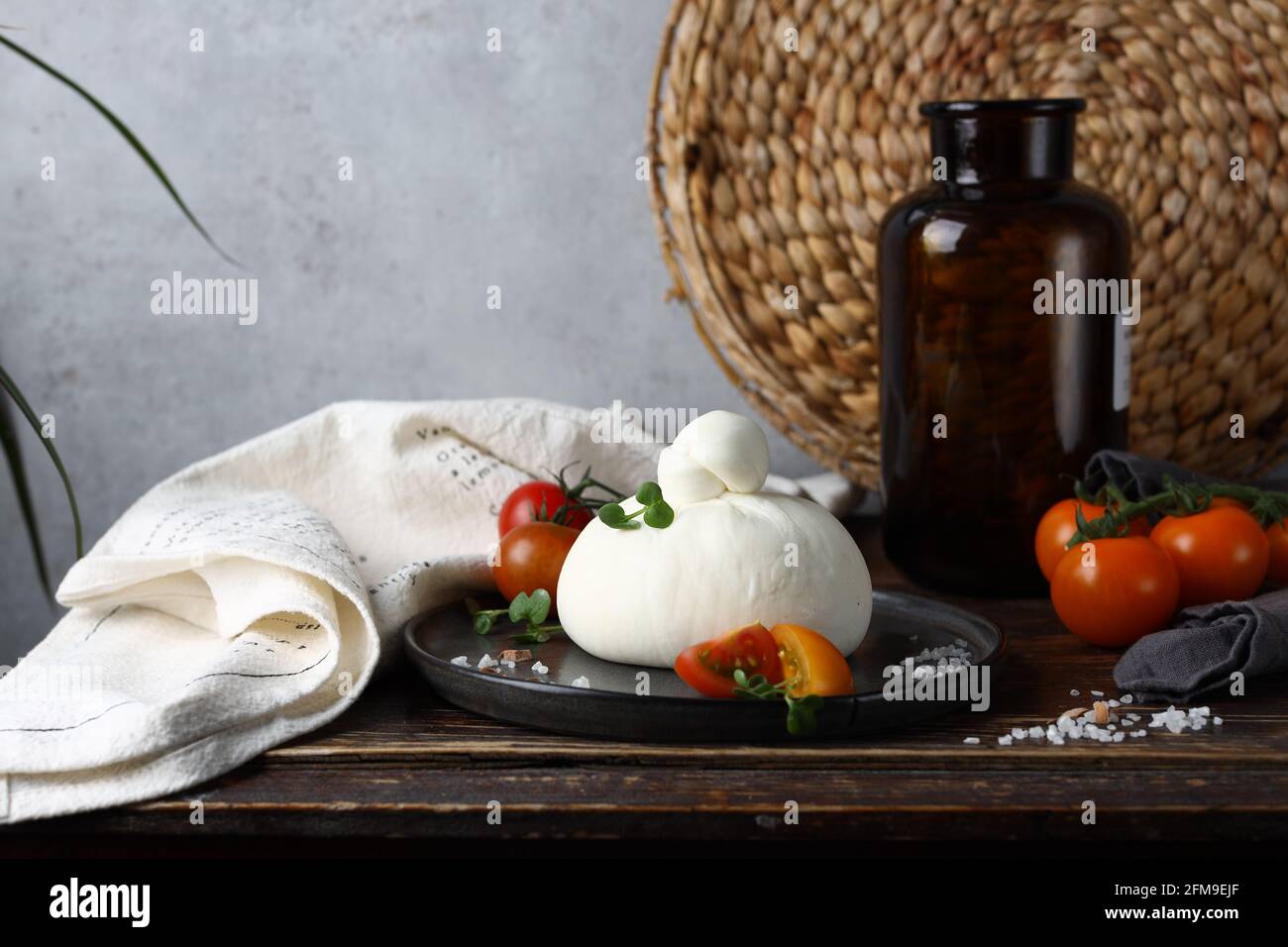homemade soft burrata cheese with tomatoes Stock Photo - Alamy