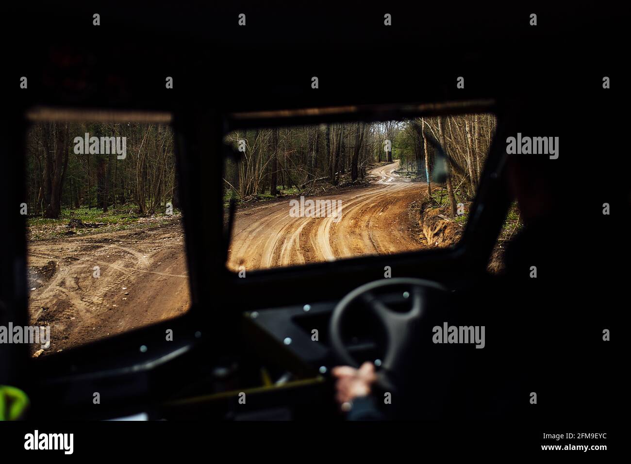 view from the interior of the SUV on the off-road. travel through the ...
