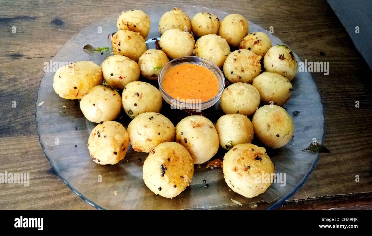 Suji appe or rice appe or appam, an Indian snack with onion, peanuts ...