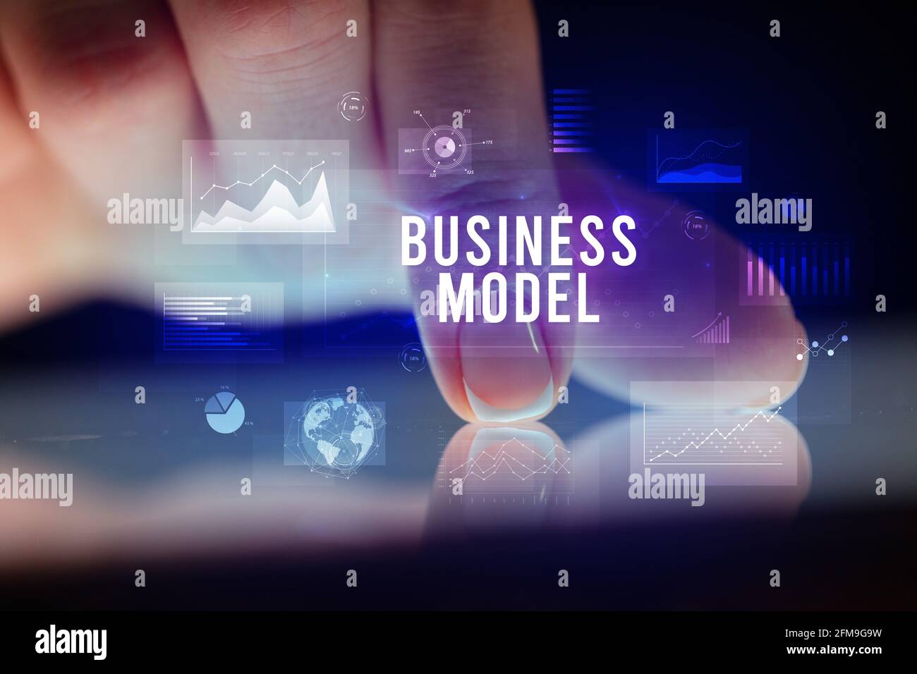 Finger touching tablet with business graphs and icons concept Stock ...