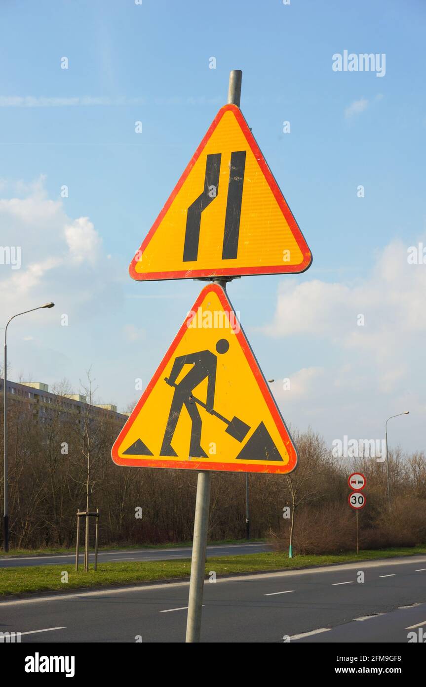 POZNAN, POLAND - Apr 06, 2016: Two traffic signs warning for road works ...