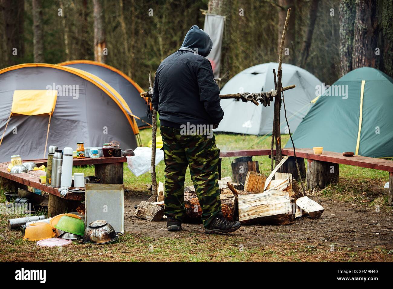 tourist tents in the forest. a group of travelers set up camp in nature ...