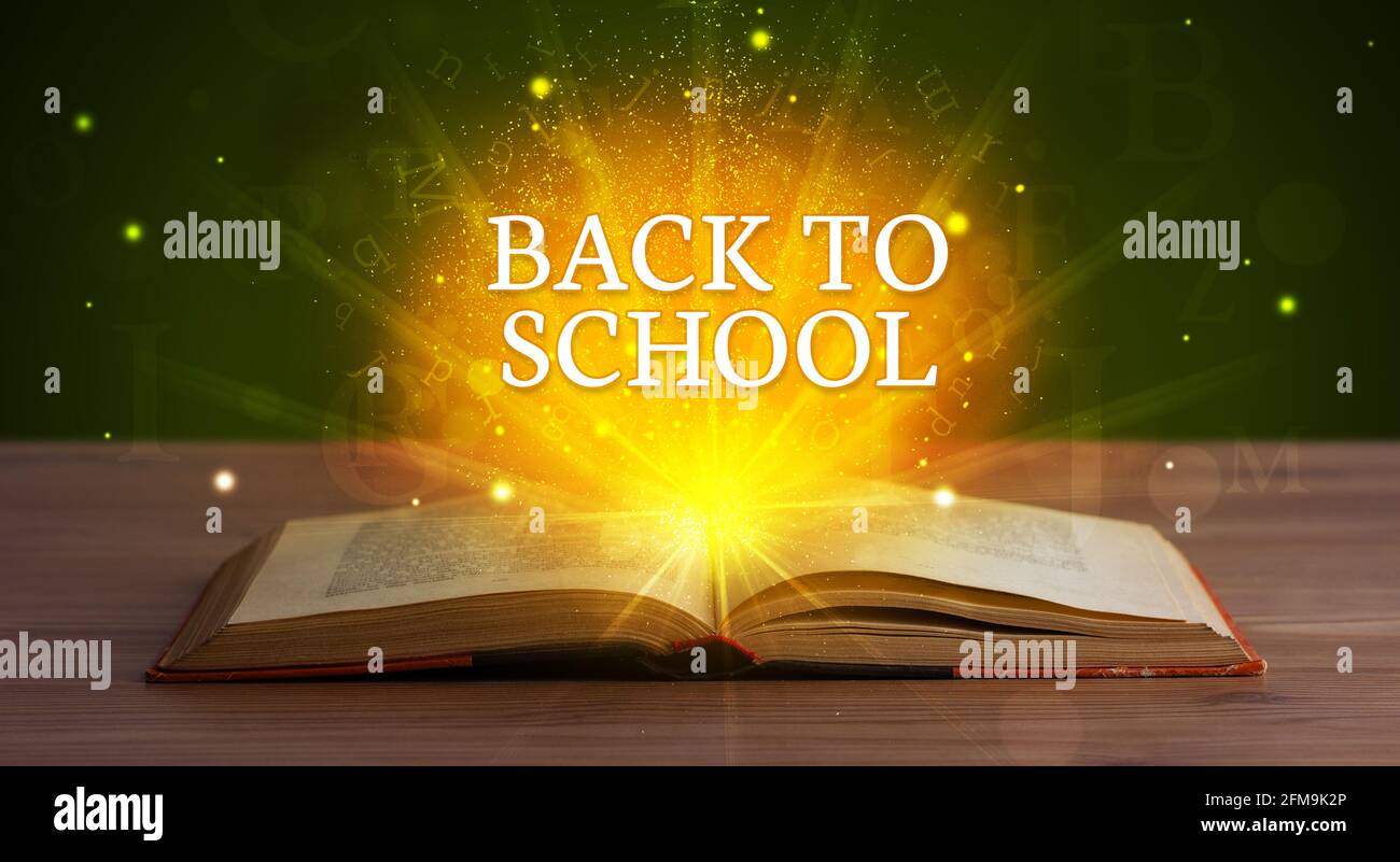 Educational inscription coming out from an open book Stock Photo - Alamy