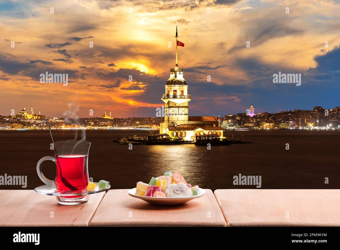 Turkish tea party near the Maiden's Tower in the night lights, Istanbul ...