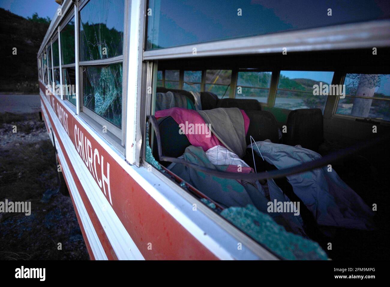 A bus filled with discarded clothes that migrants have left after ...