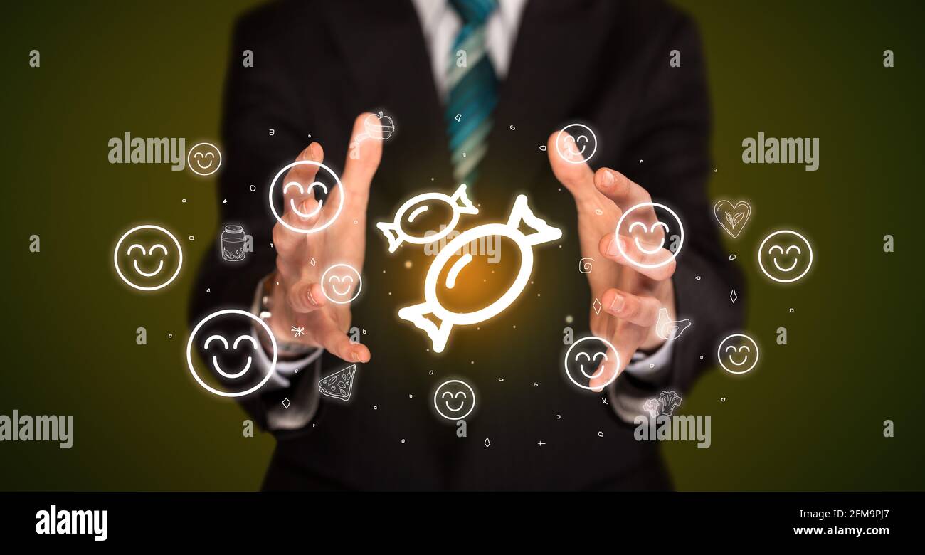 Hand holding food related icons Stock Photo - Alamy