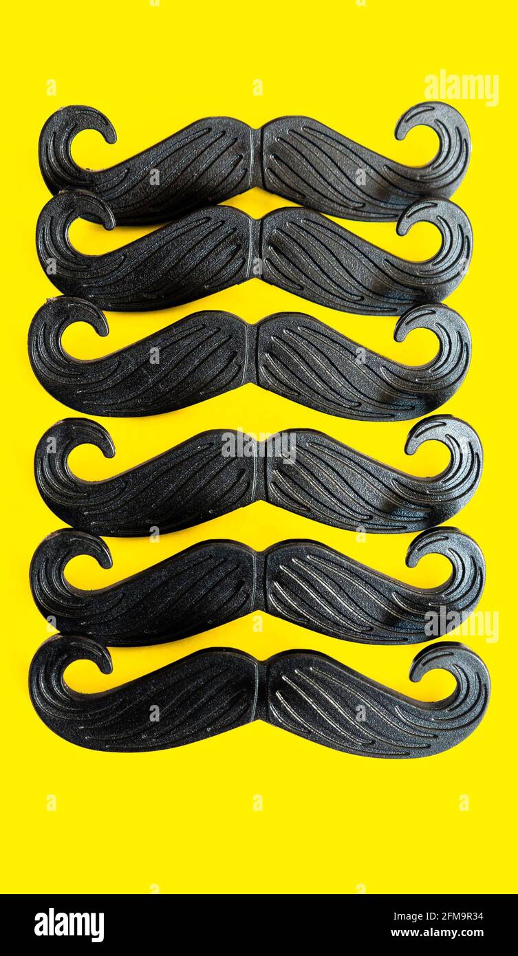 Composition of mustache. Mustache on a yellow background. No shave ...